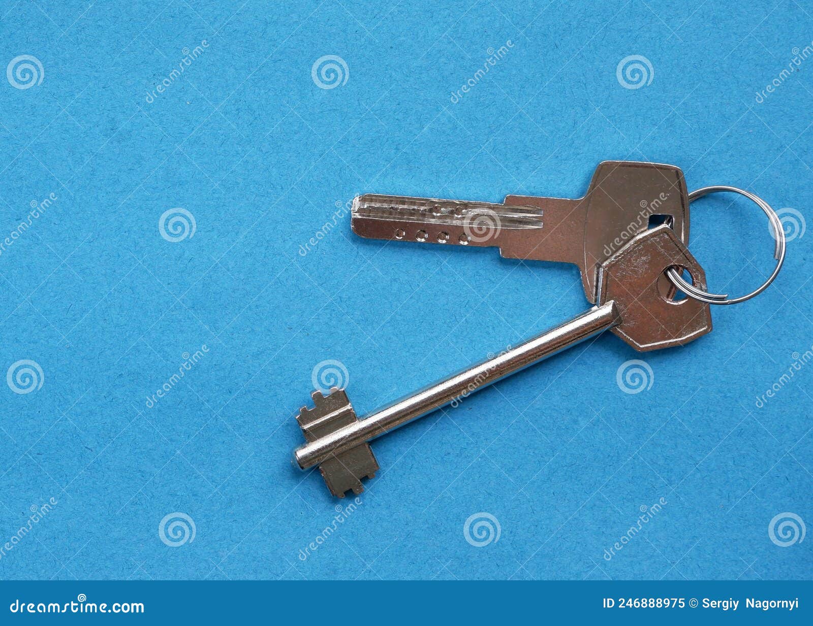 House Keys on a Blue Background Close-up Stock Image - Image of ...