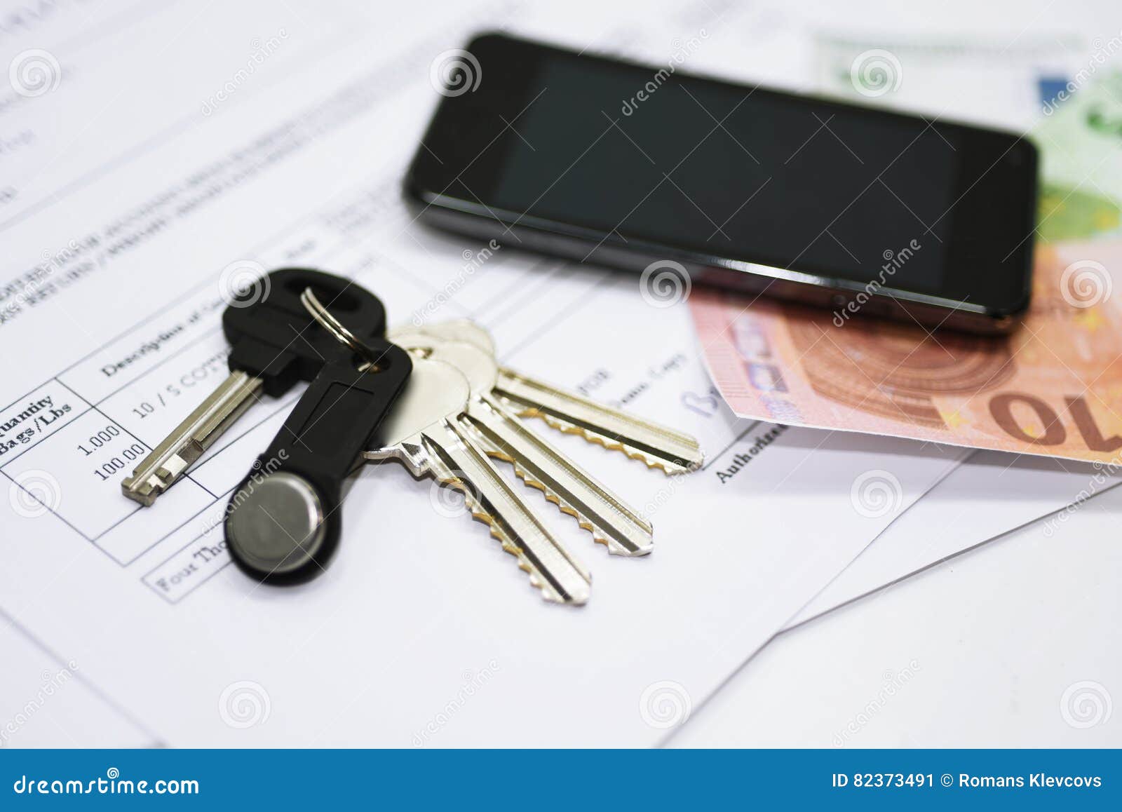 House Keys on Documents with Mobile Phone Stock Image - Image of ...