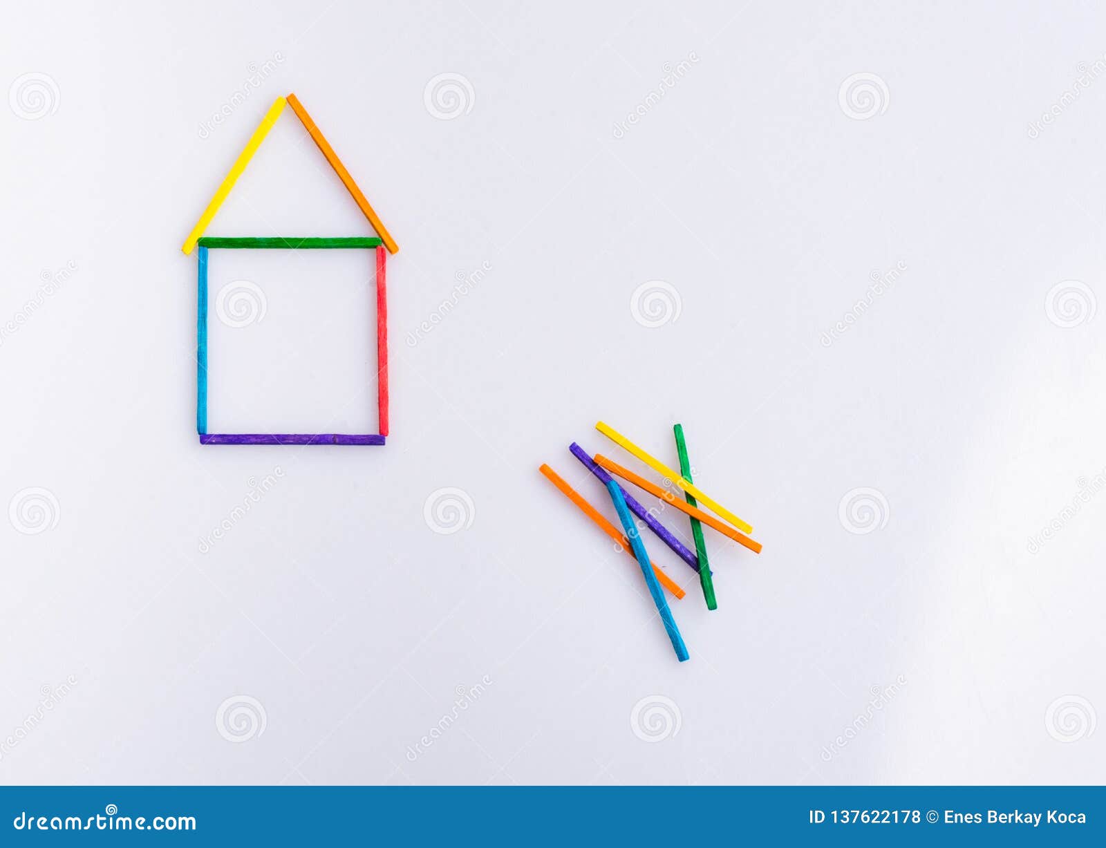 A House Made of Colorful Sticks with a Bunch of More Sticks Stock Photo ...