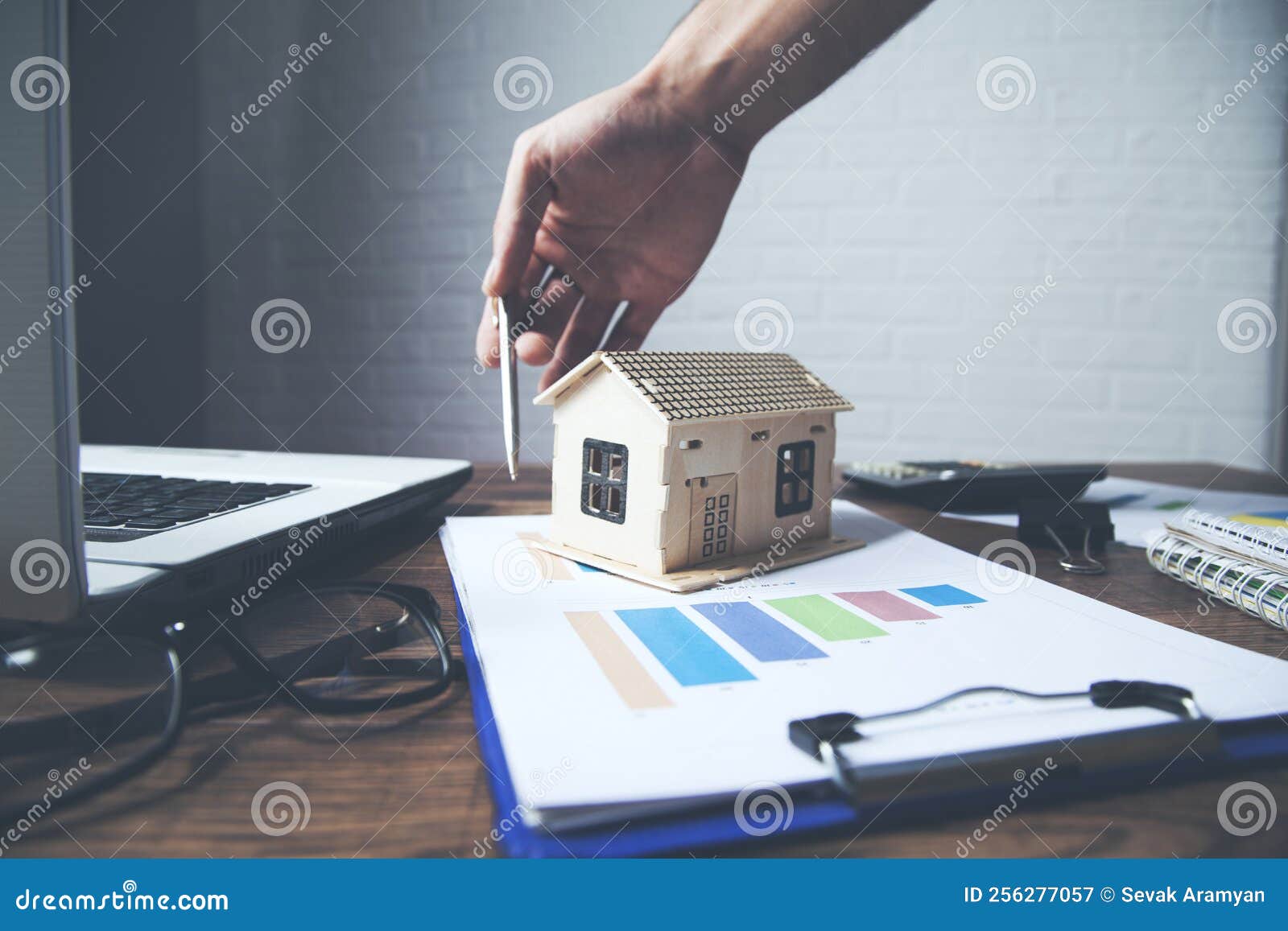 House Model on Business Graphs Stock Image - Image of hand, sale: 256277057