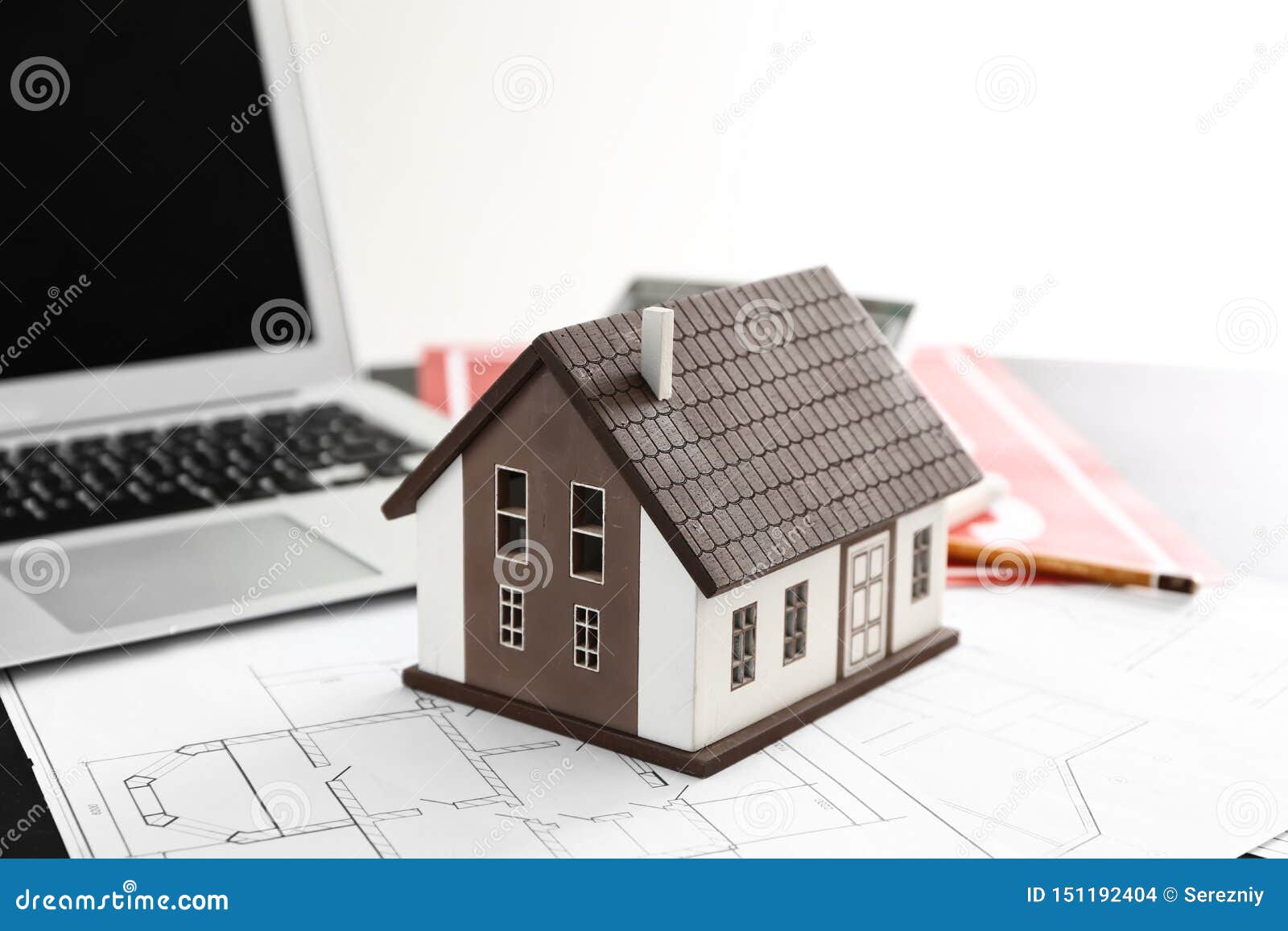 House Model with Drawings and Laptop on Table. Mortgage Concept Stock ...