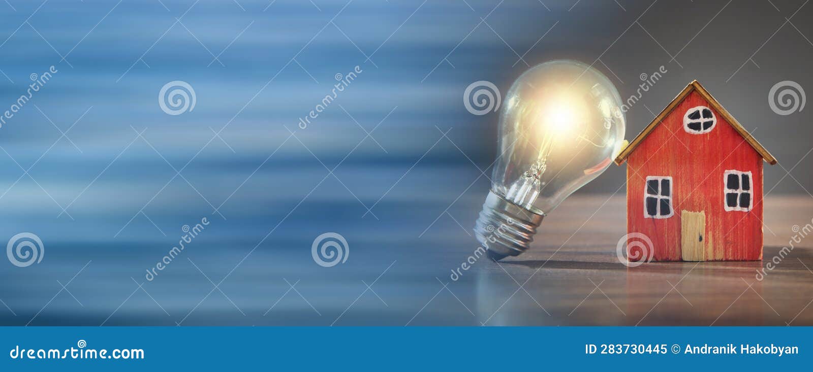 House Model and Light Bulb on the Wooden Table Stock Image - Image of ...