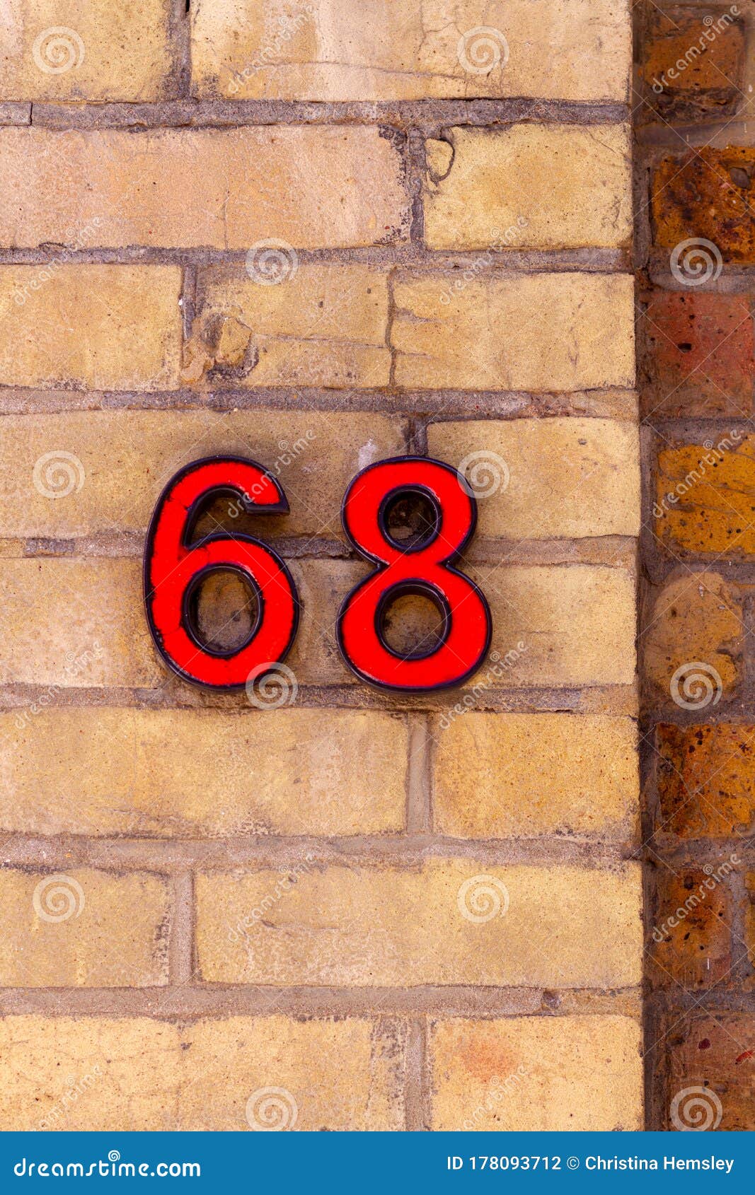 House Number 68 in Bright Red Digits on a Brick Wall Stock Photo ...