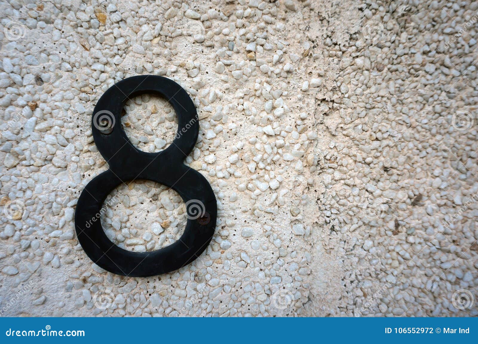 House number eight on wall stock photo. Image of closeup - 106552972
