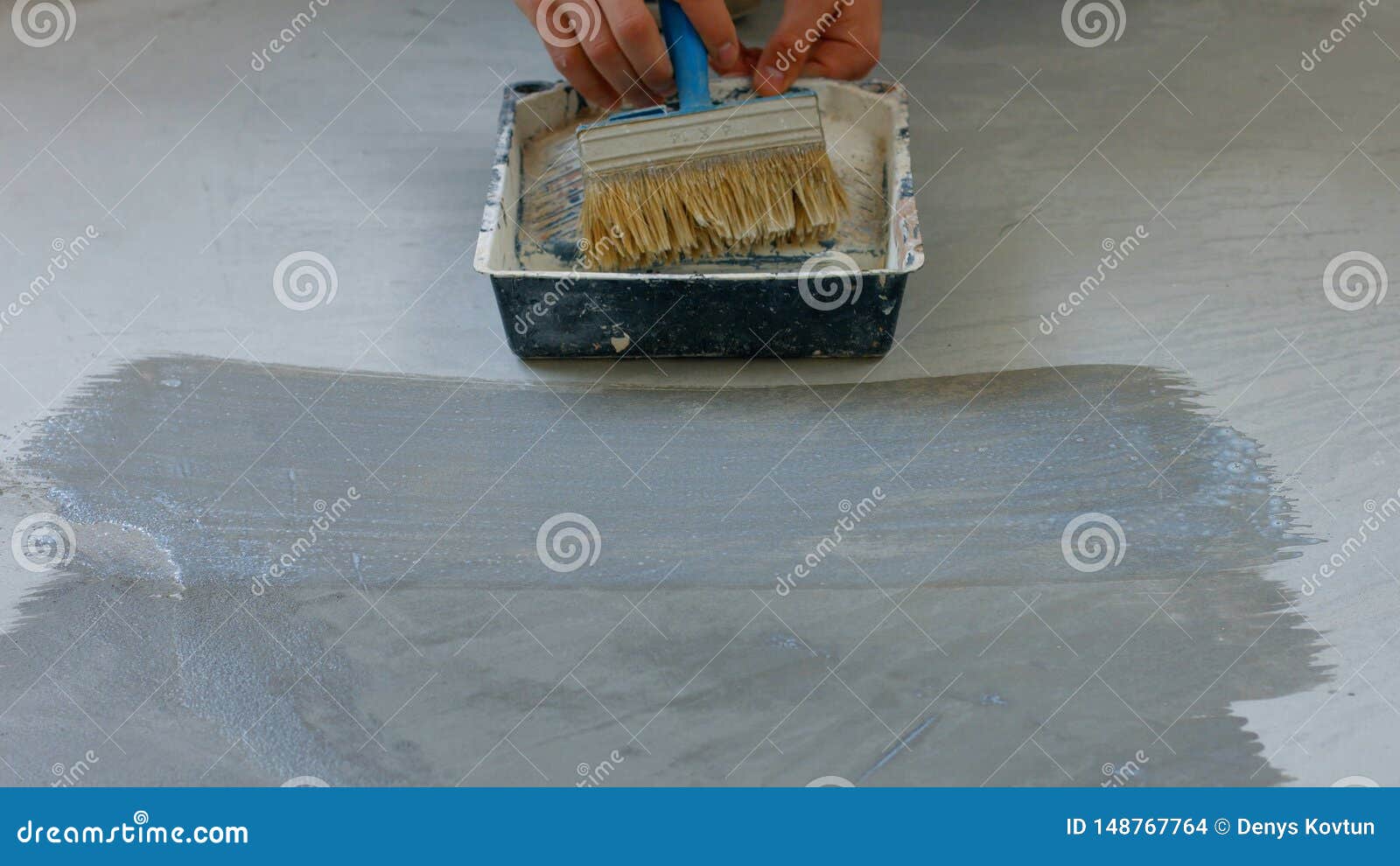Priming The Concrete Floor With A Roller. Professional Floor Primer ...