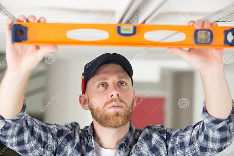 House Renovation Worker Checking Alignment Ceiling Stock Image - Image ...