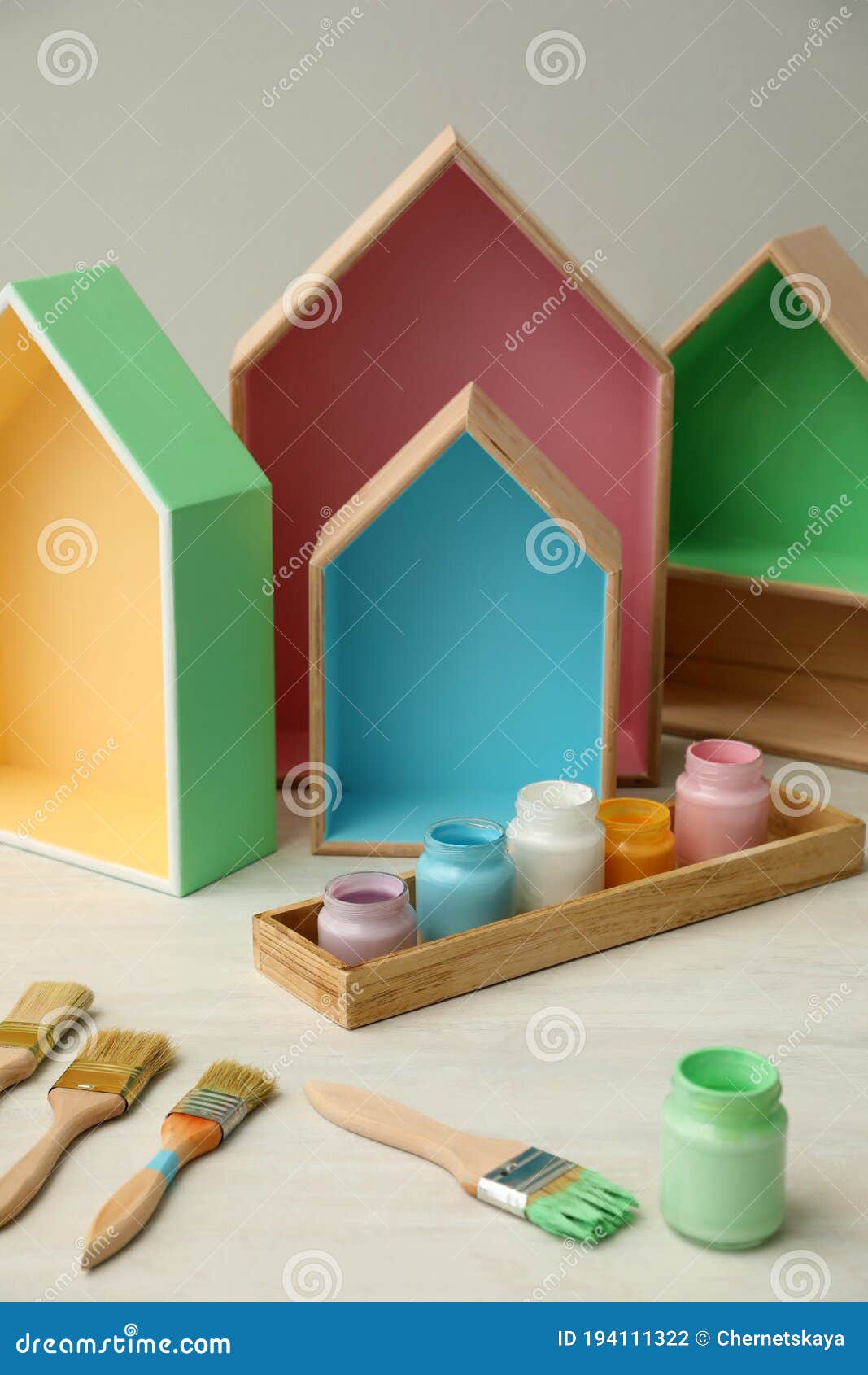 House Shaped Shelves, Jars of Paints and Brushes on Table. Interior ...