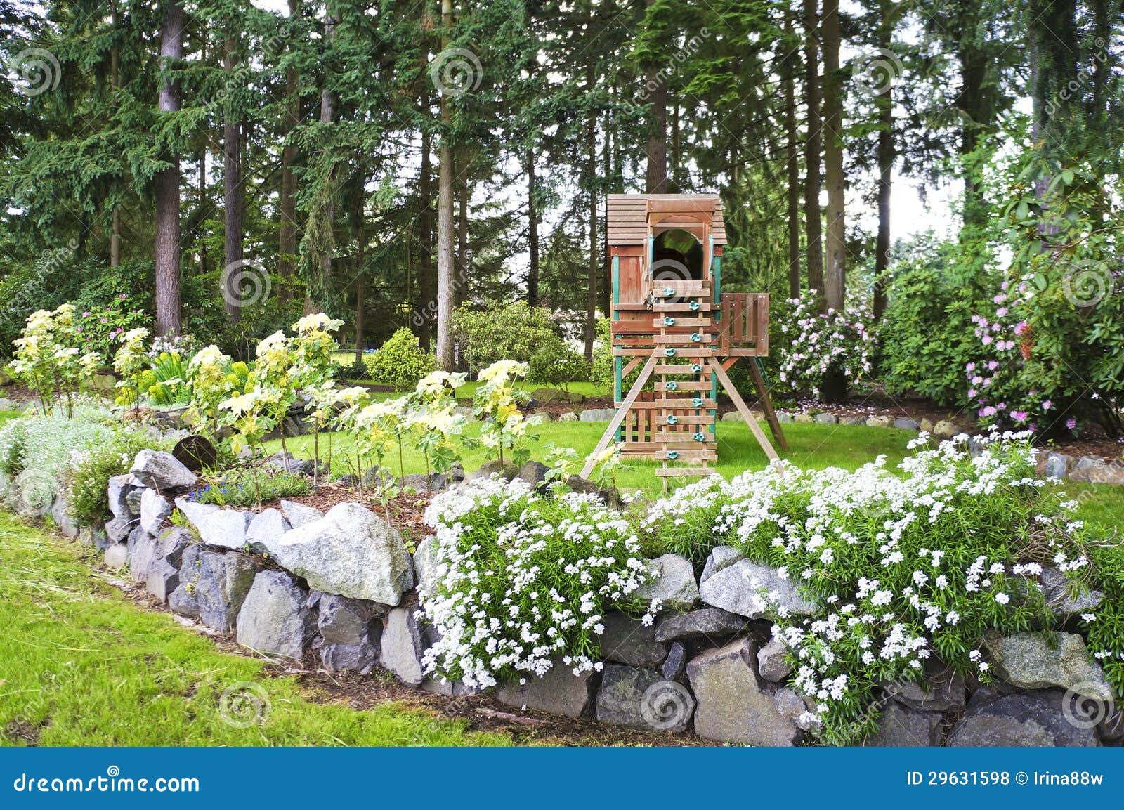 House Spring Backyard with Rock Wall and Kids Playground. Stock Photo ...