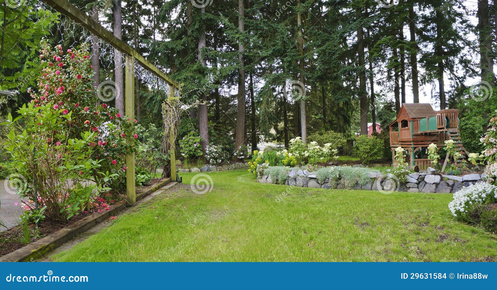 House Spring Backyard with Roses Patio and Kids Playground. Stock Photo ...