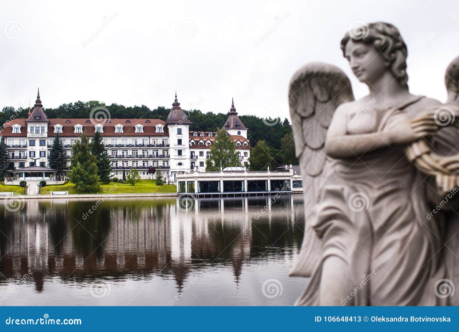 House and Stone Statue in a Forest on a Lake Stock Image - Image of ...