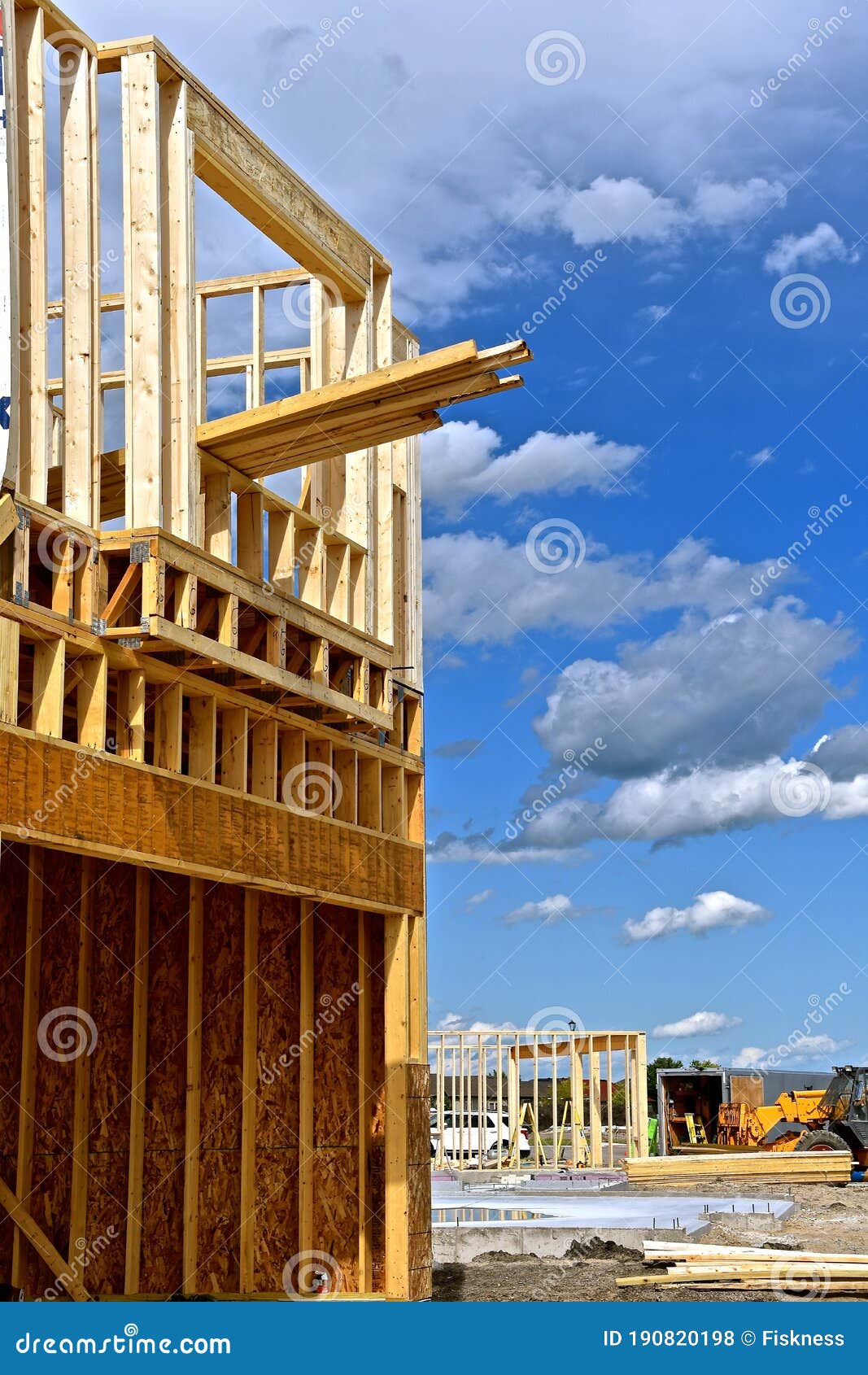 House Under Construction with Lumber Sticking Out Over Window Frame ...