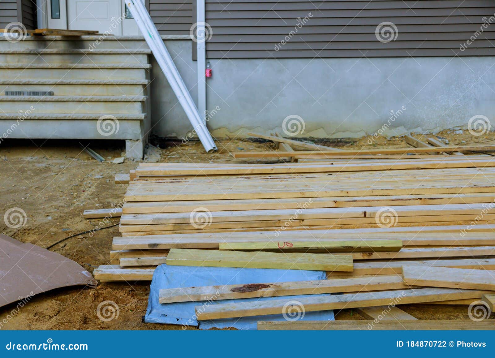 Stack Of Unloading Wooden Beams On Construction Building From Beam ...