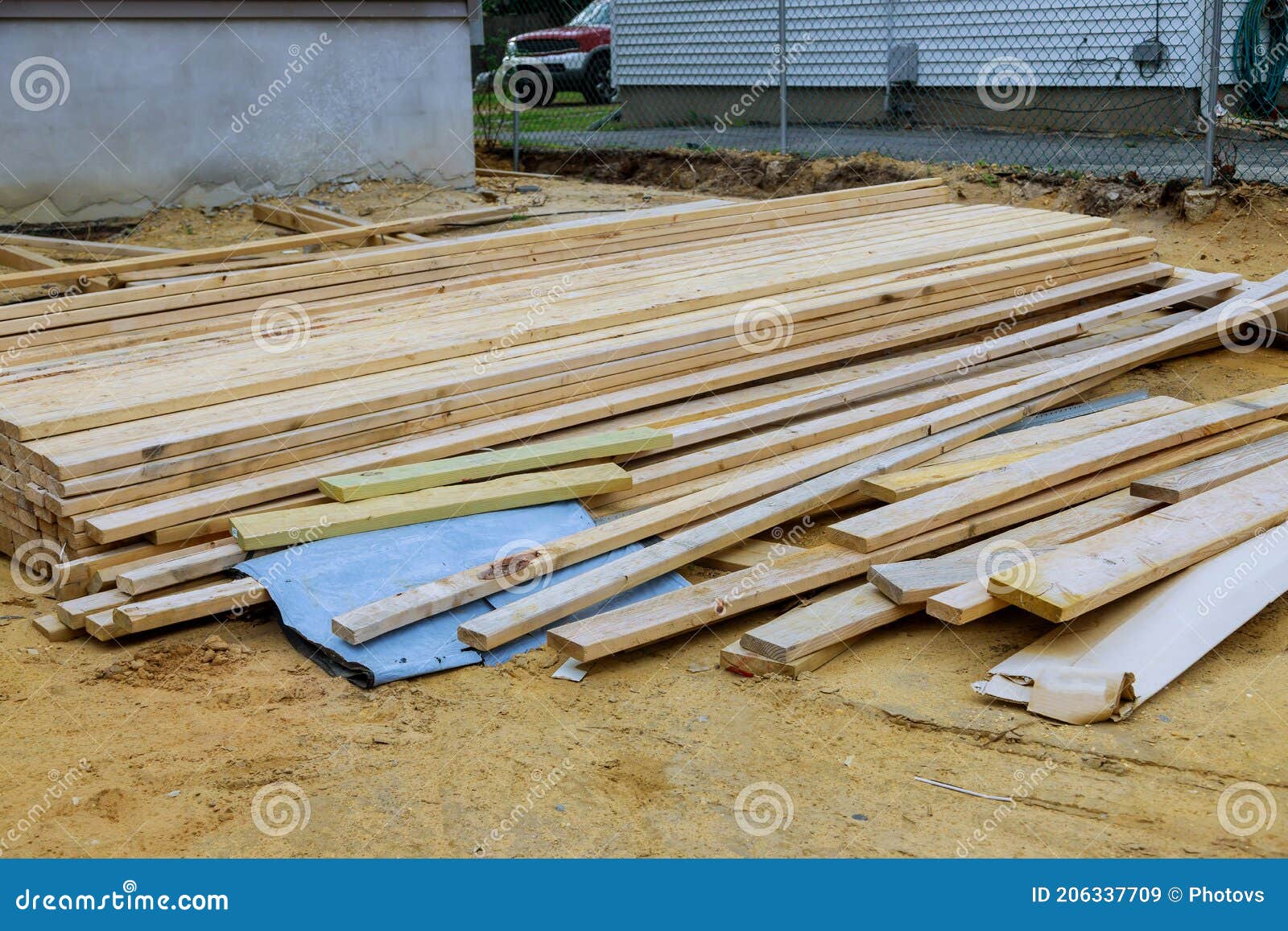 Stack Of Unloading Wooden Beams On Construction Building From Beam ...