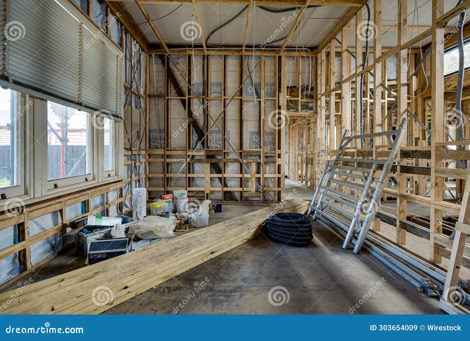 A House Undergoing Renovation Is Surrounded By An Extensive Scaffolding ...