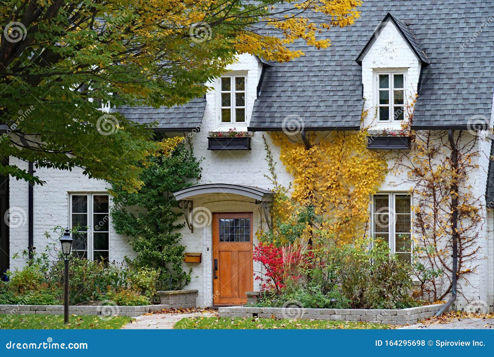 House with White Painted Bricks and Dormer Window Stock Photo - Image ...