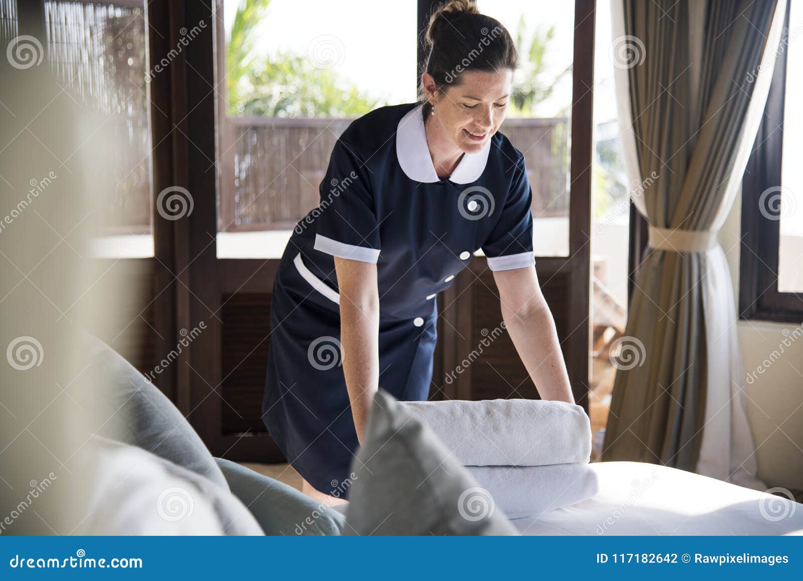 Housekeeper Cleaning a Hotel Room Stock Photo - Image of bedroom ...