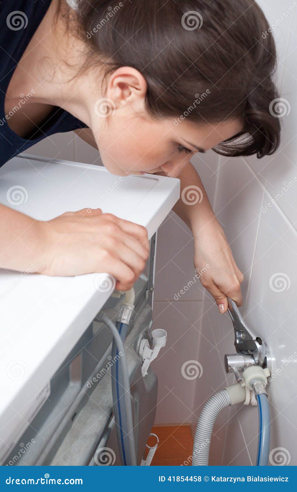 Housekeeper Having Problem with Washing Machine Stock Photo - Image of ...
