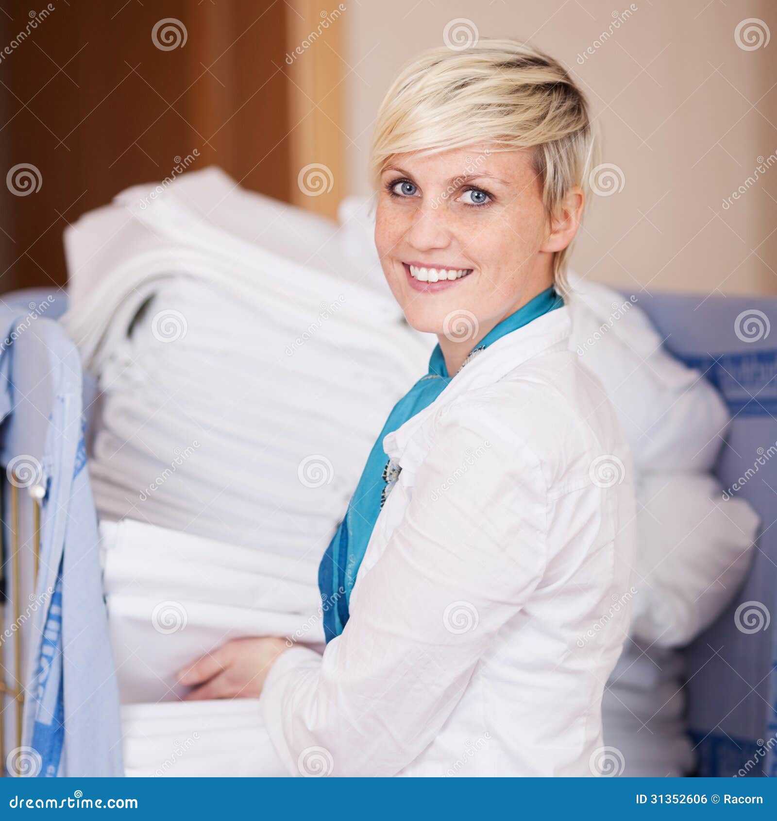 Housekeeper Stacking Sheets in Stock Room Stock Photo - Image of hotel ...