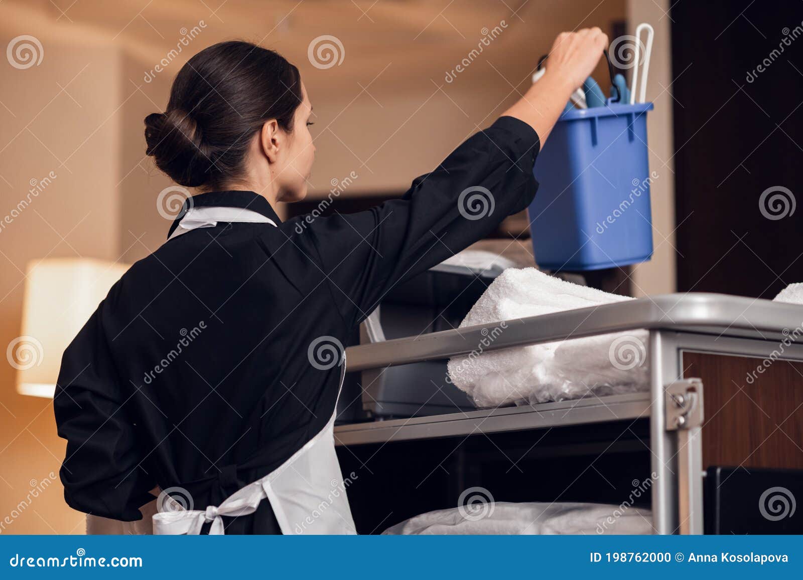 A Housekeeping Lady in a Uniform Cleaning the Room Stock Photo - Image ...