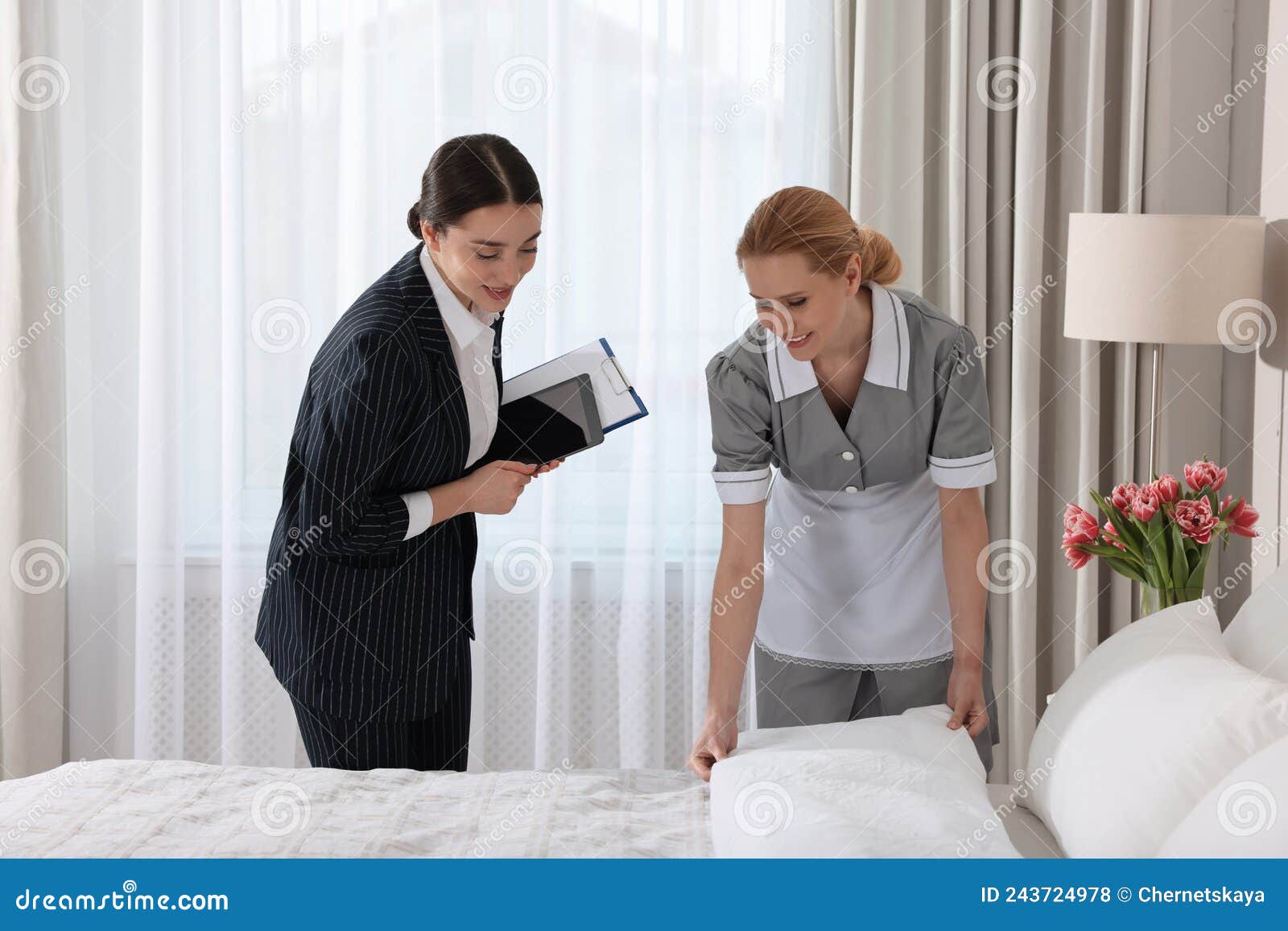Housekeeping Manager with Tablet Checking Maid`s Work in Hotel Bedroom ...