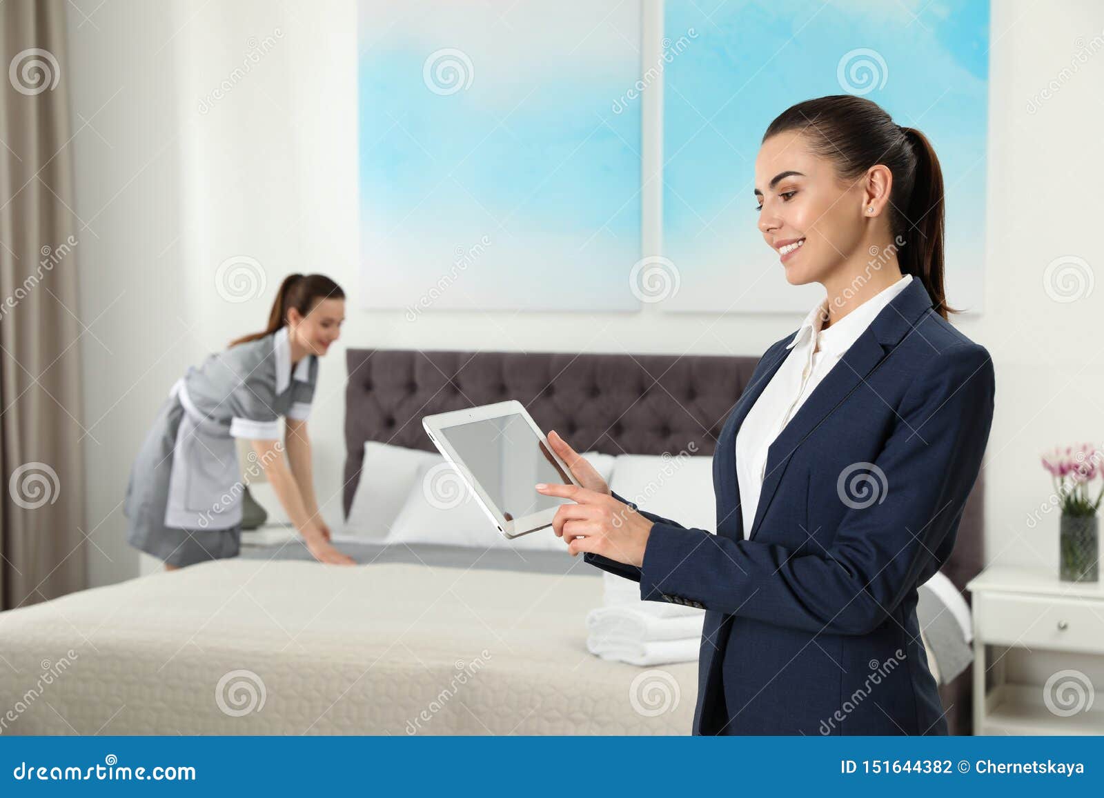 Housekeeping Manager with Tablet Checking Maid Work in Hotel Room Stock ...
