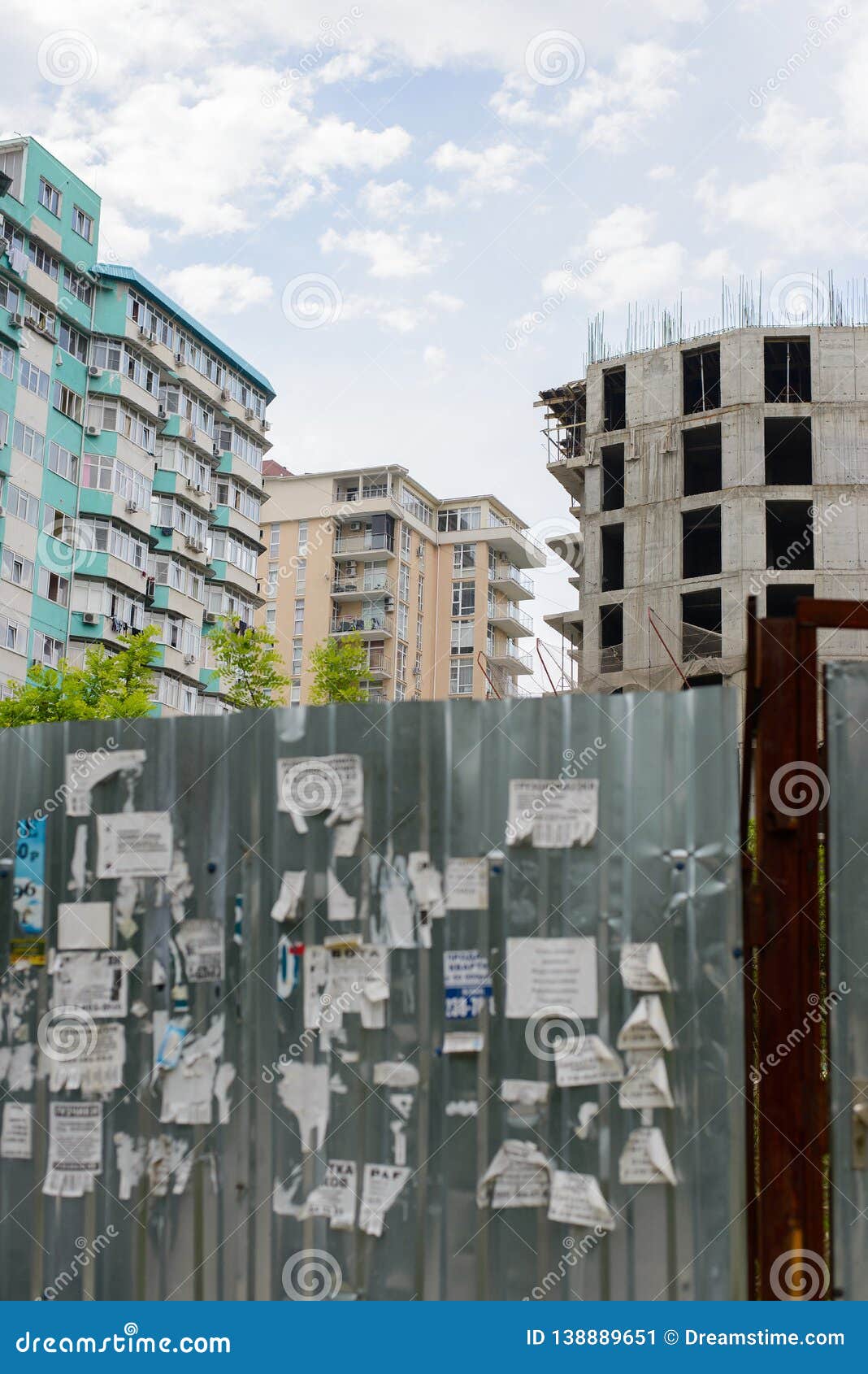 Houses Under Construction Behind the Fence with Ads Stock Image - Image ...