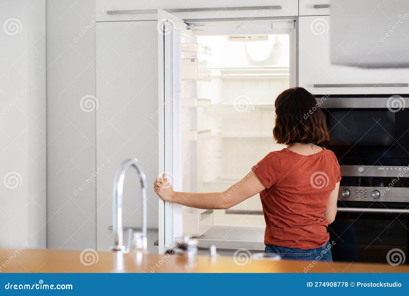 Housewife Looking Inside of Empty Fridge while Standing in Kitchen ...