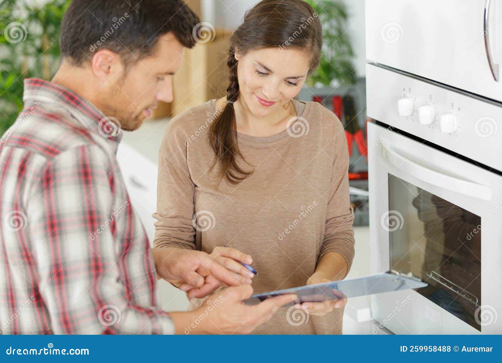 Housewife Talking To Plumber after Quick Service Stock Photo - Image of ...