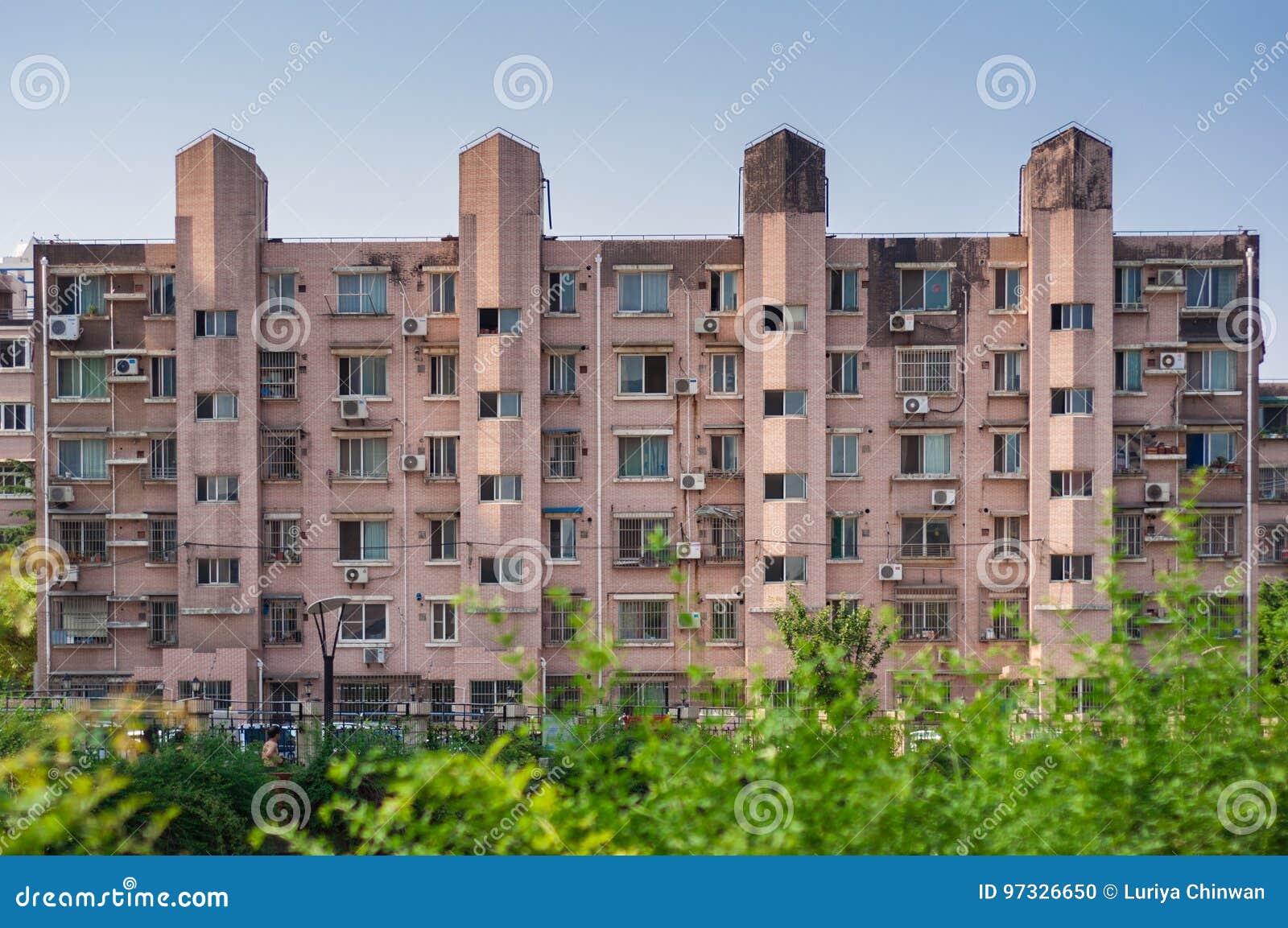 Housing Building with Green Bush Stock Photo - Image of park, apartment ...