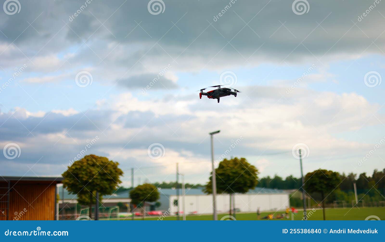 Hovering Drone Flying Upward on a Cloudy Sky Backdrop. Copter Flying ...