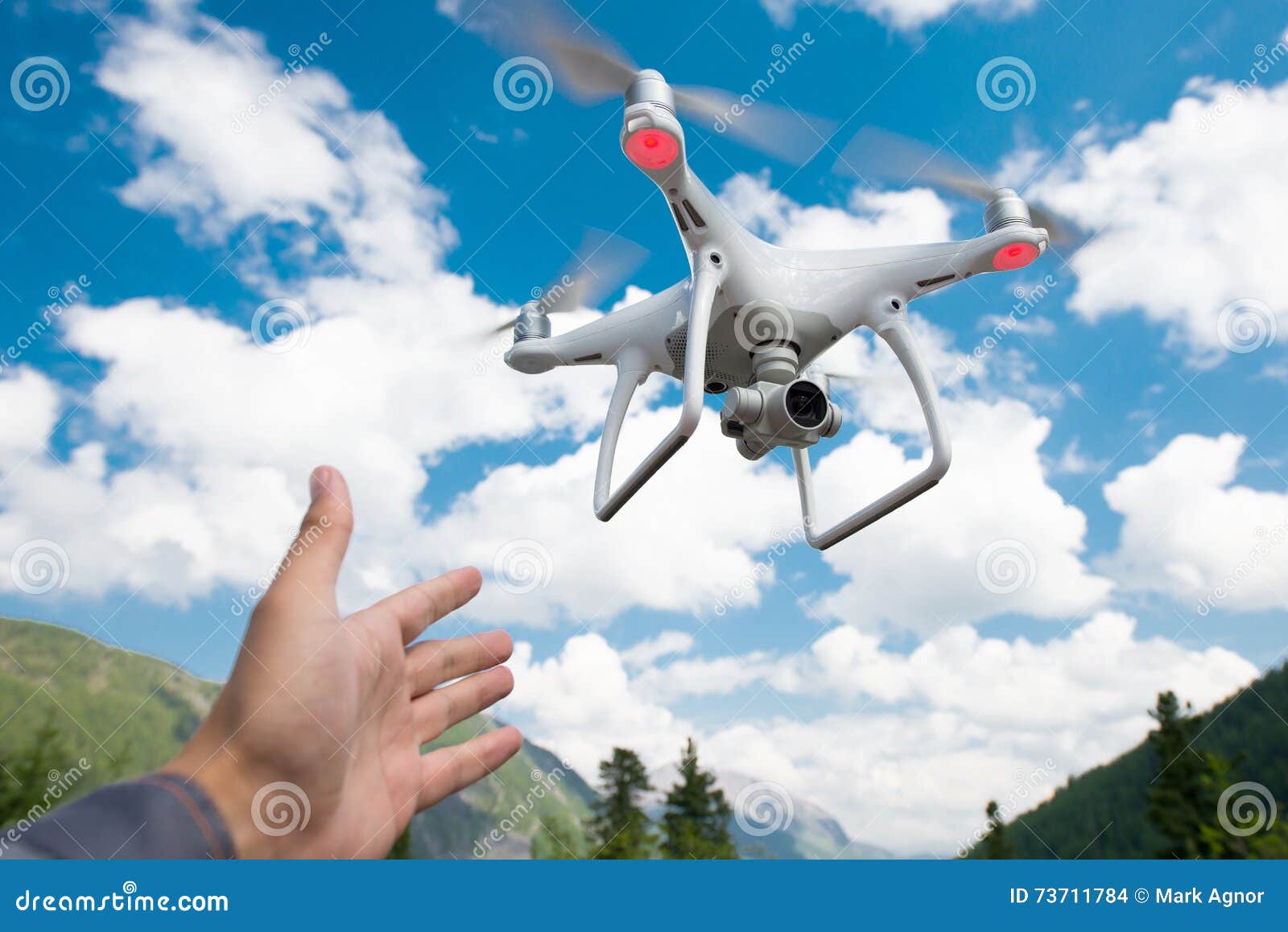 Hovering drone and a hand stock photo. Image of hand - 73711784