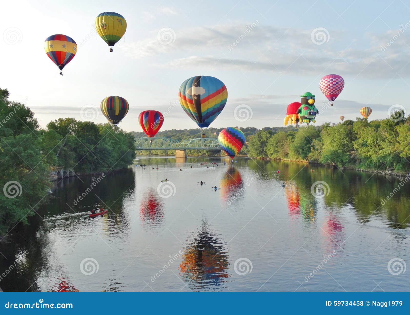 Hovering hot air balloons stock photo. Image of river - 59734458