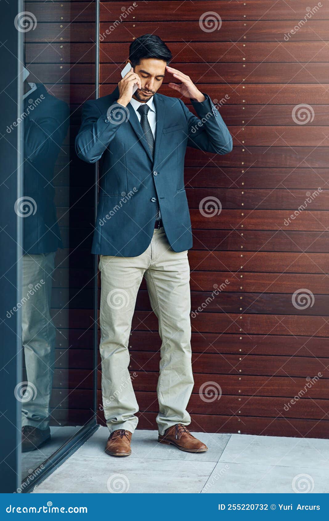 How Did this Happen. a Businessman Taking a Call Outside the Office ...