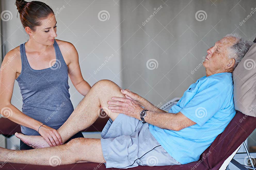 How Does that Feel. an Elderly Man Having a Physiotherapy Session. Stock Photo - Image of male ...