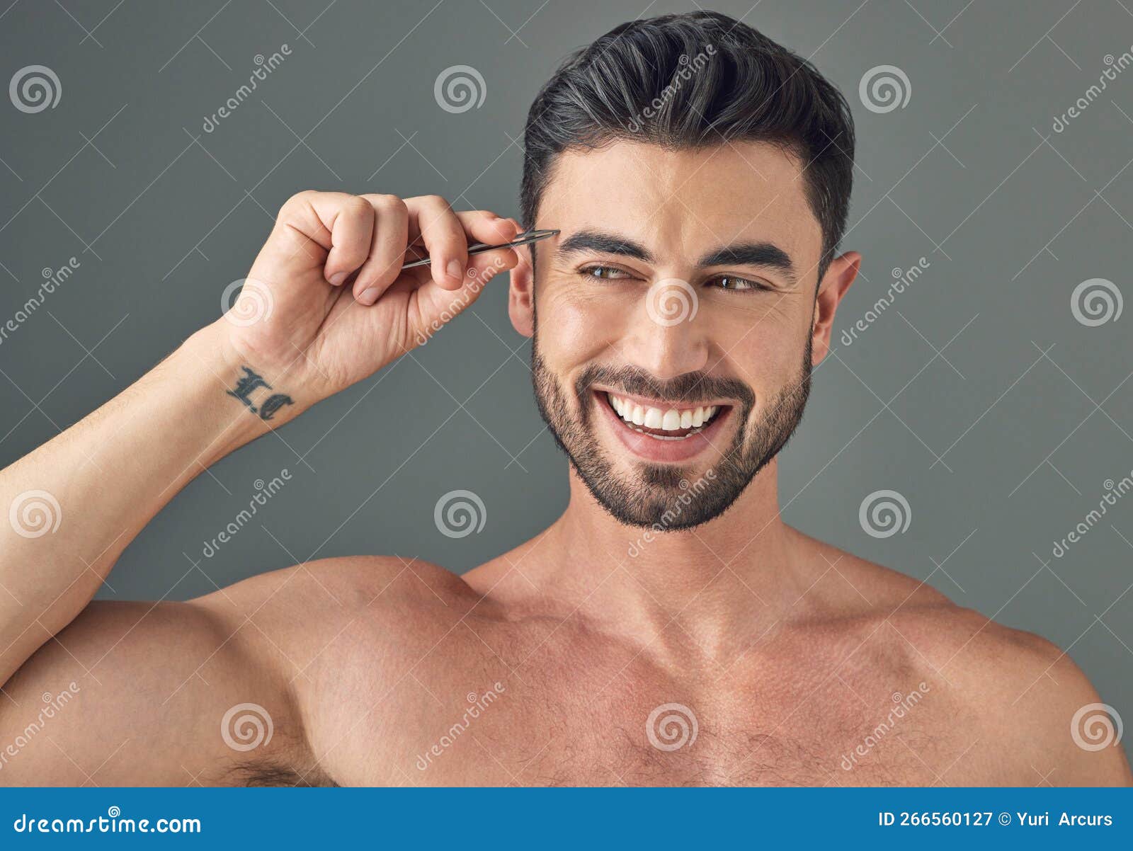 How Does he Get His Brows so Perfect. a Handsome Young Man Tweezing His ...