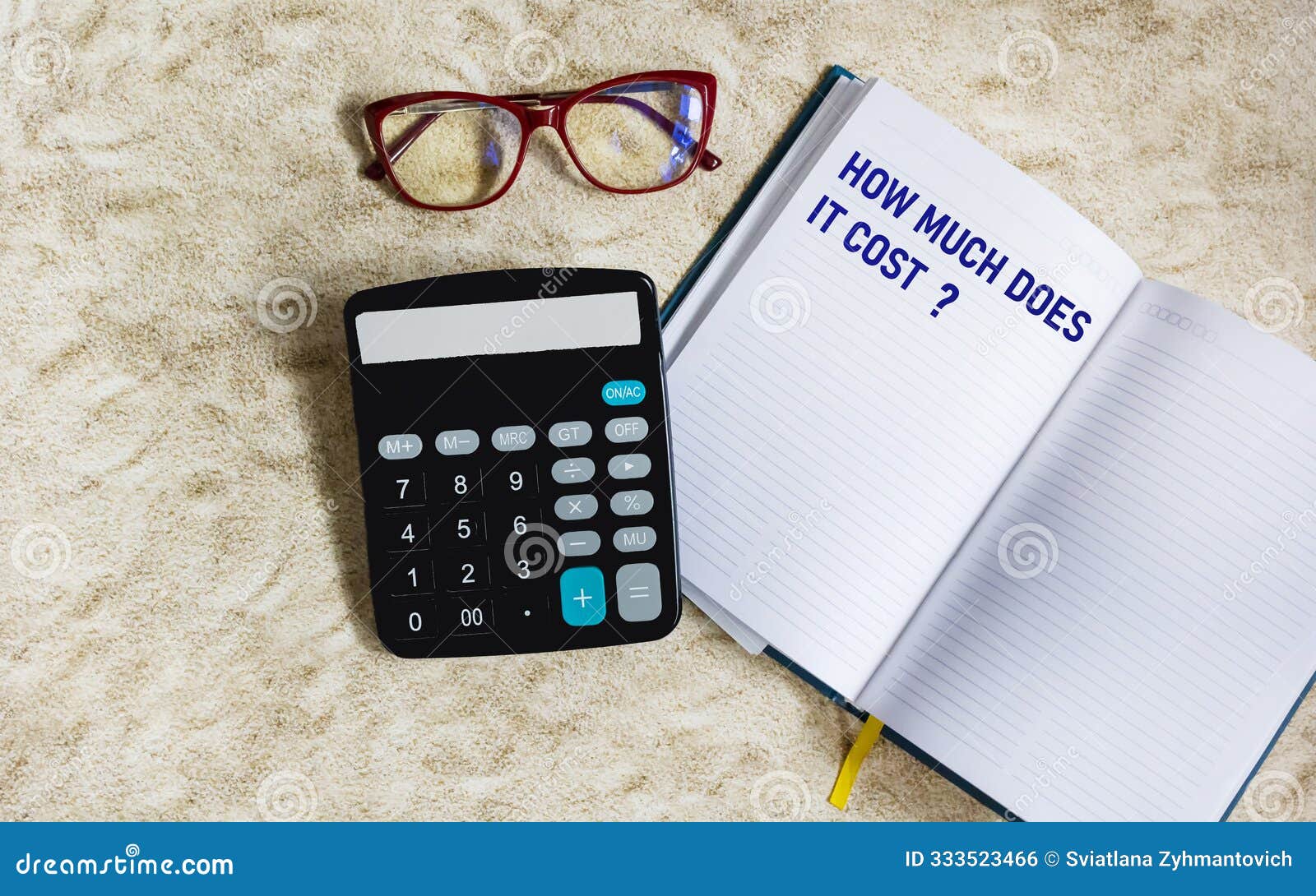 How Much it Costs is Written on a Notepad, on a Light Background, Next ...