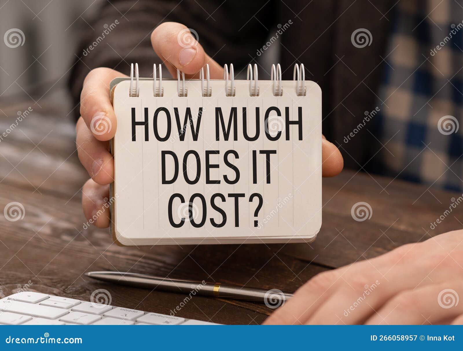 How Much Does it Cost Text Written in the Notebook in Hand. Stock Image ...