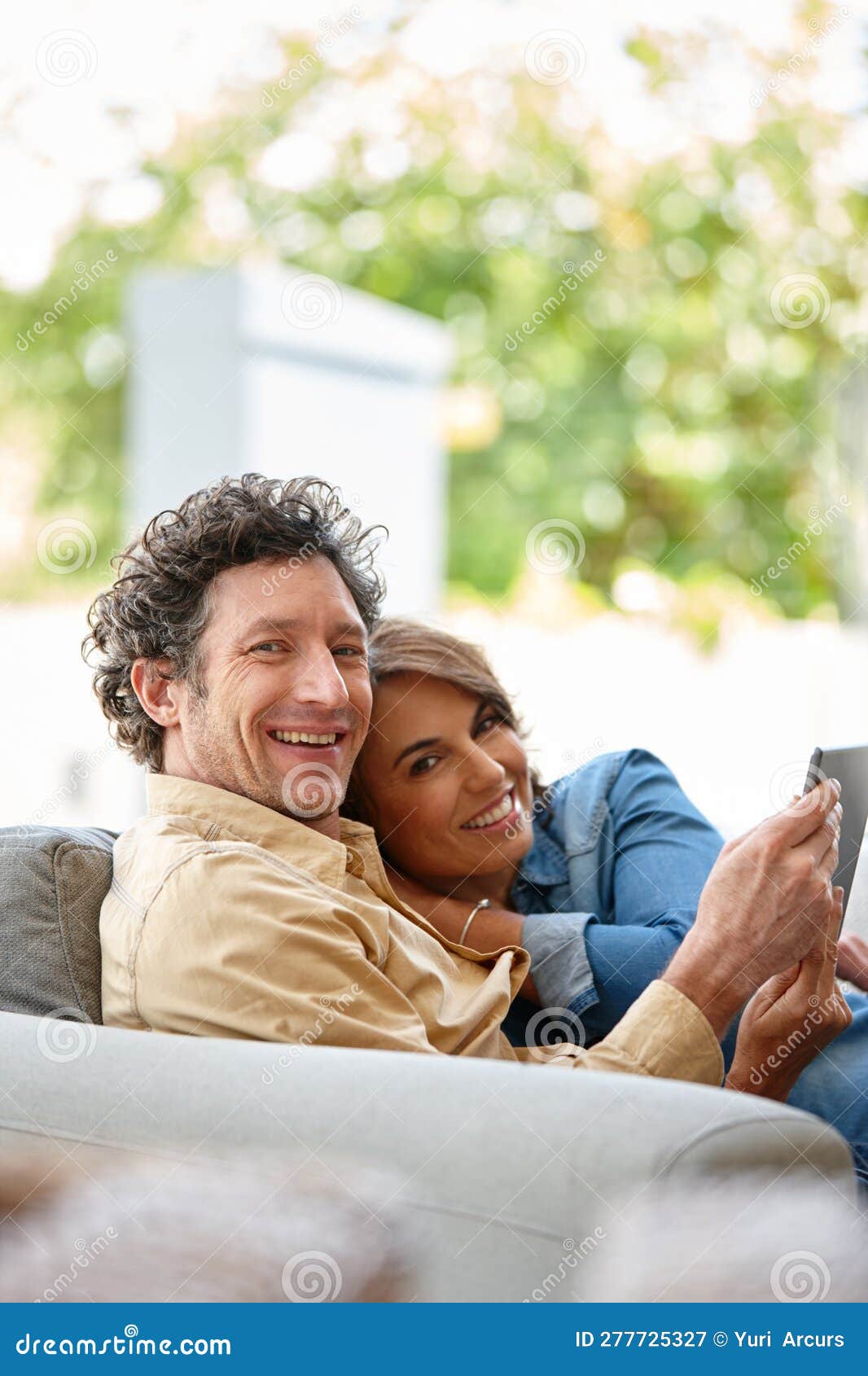 This is How we Spend Our Weekends. a Husband and Wife Using a Digital ...