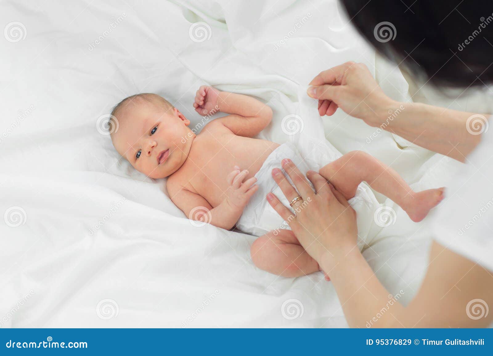 How to wear a diaper stock image. Image of diaper, mother - 95376829