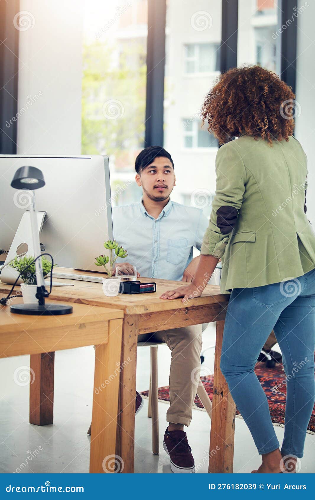 Hows Your Project Coming Along. Two Creative Colleagues Working ...