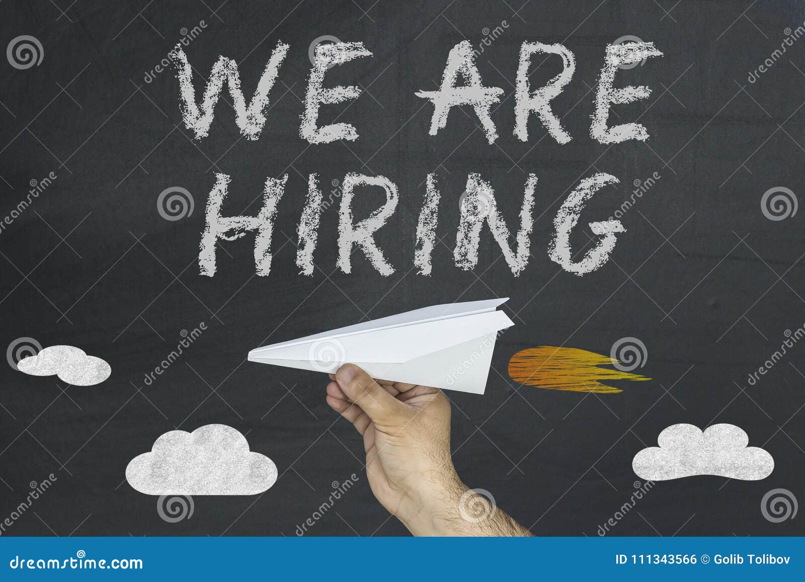 HR Concept. Hand with Plane and Text: we are Hiring. Stock Photo ...