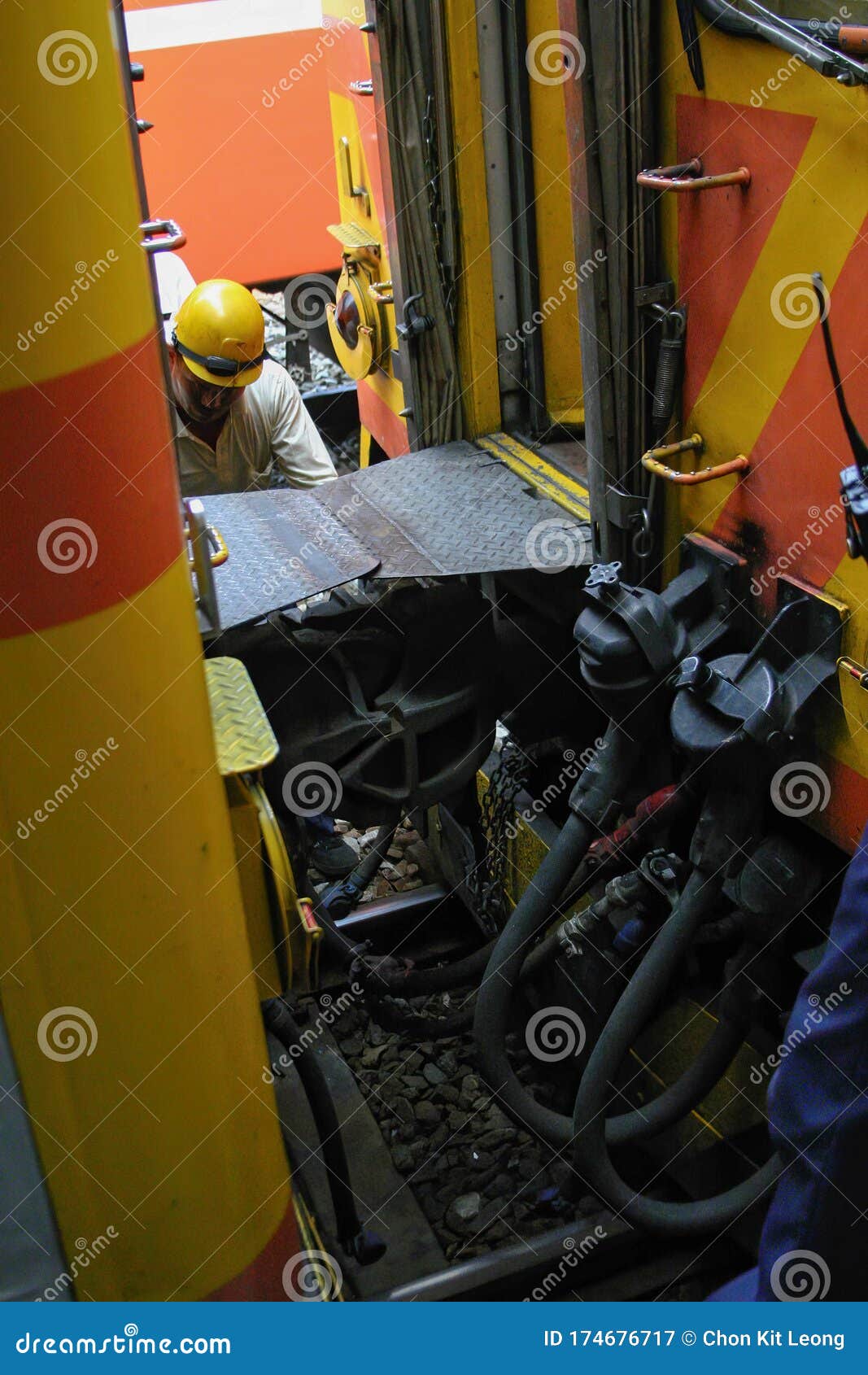Worker Working on the Connection between Two Train Section Editorial ...