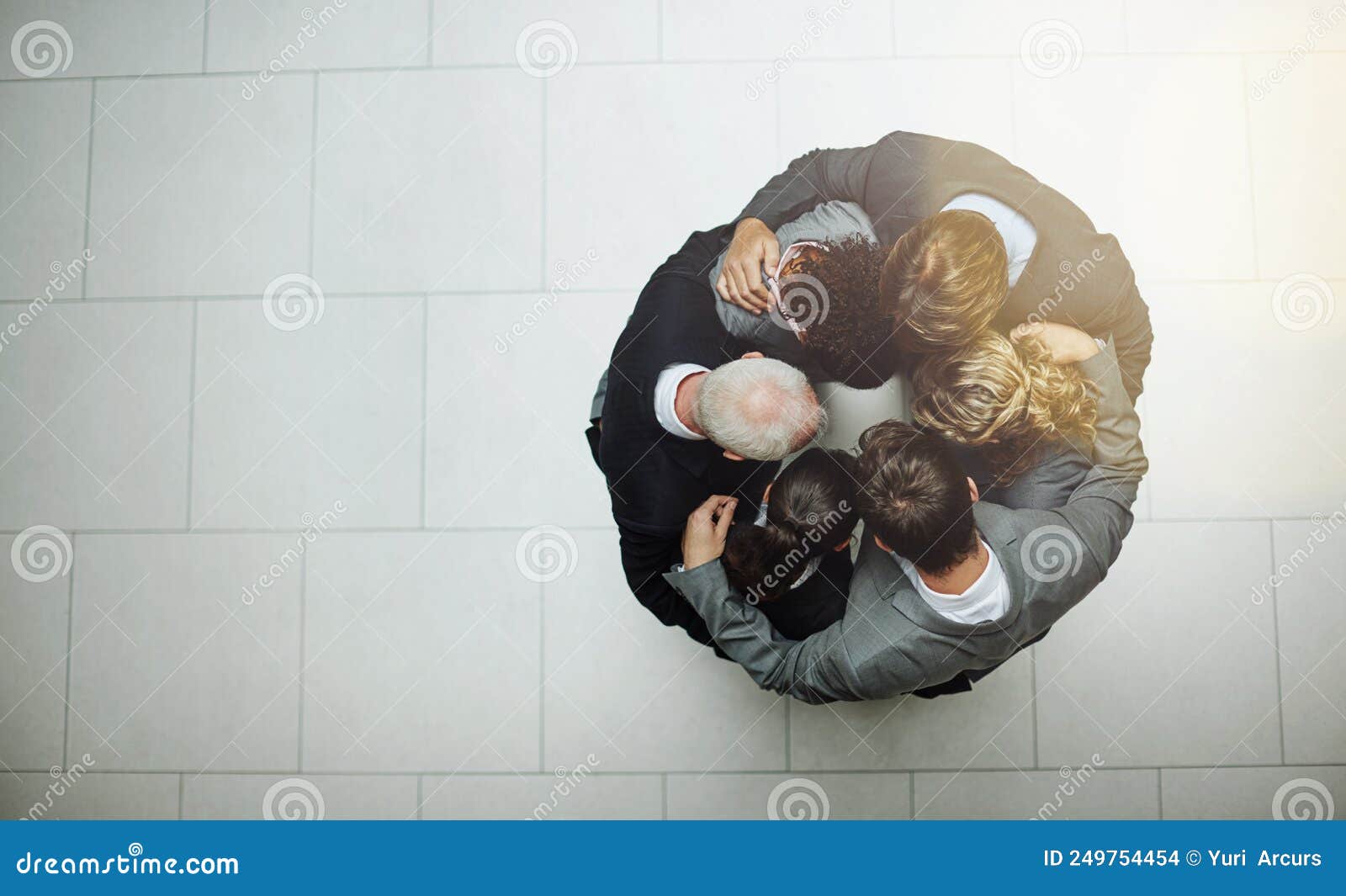 The Huddle before Work. High Angle Shot of a Group of Businesspeople ...