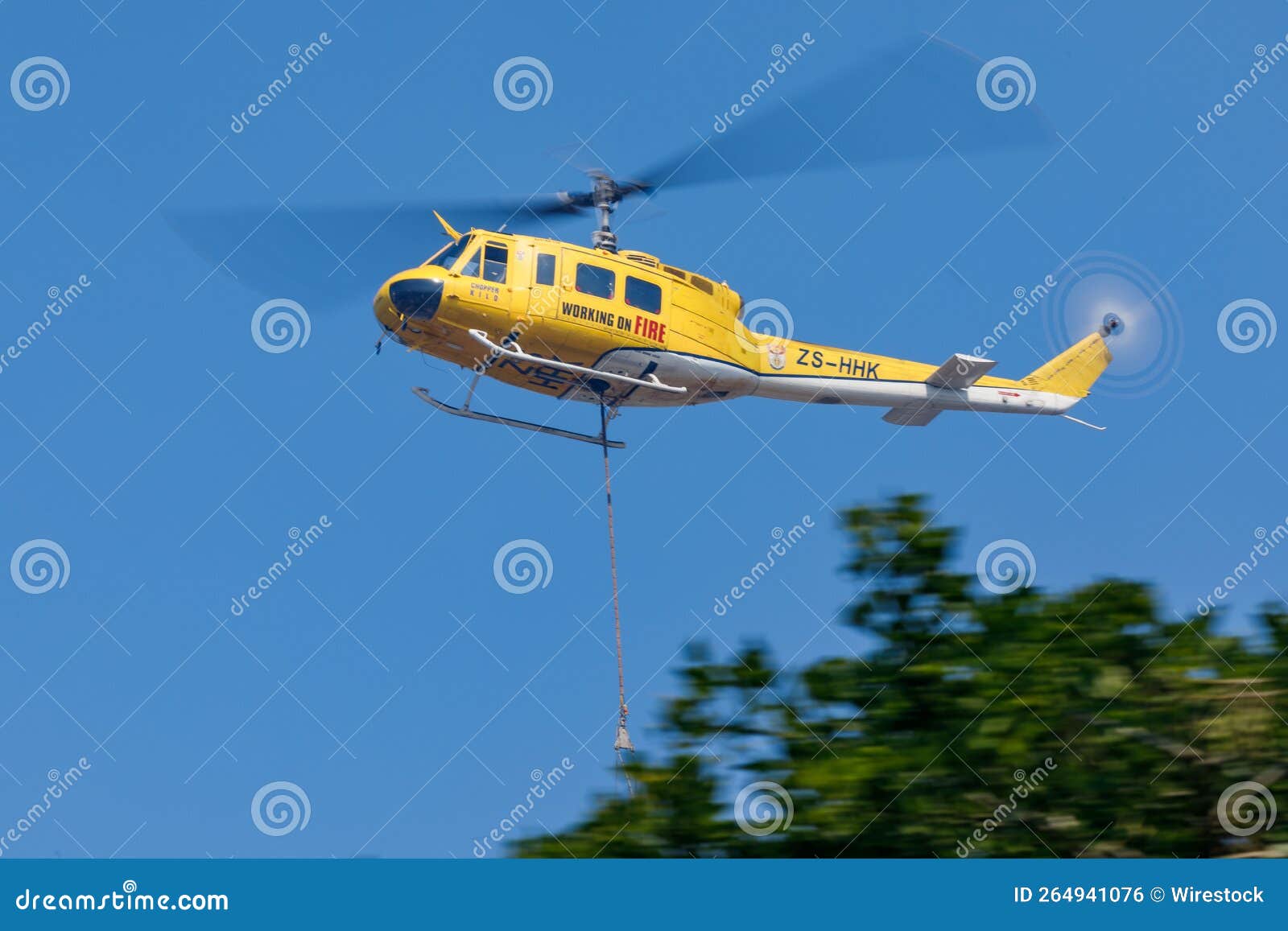 Huey Firefighting Helicopter Over Green Trees Editorial Photo - Image ...