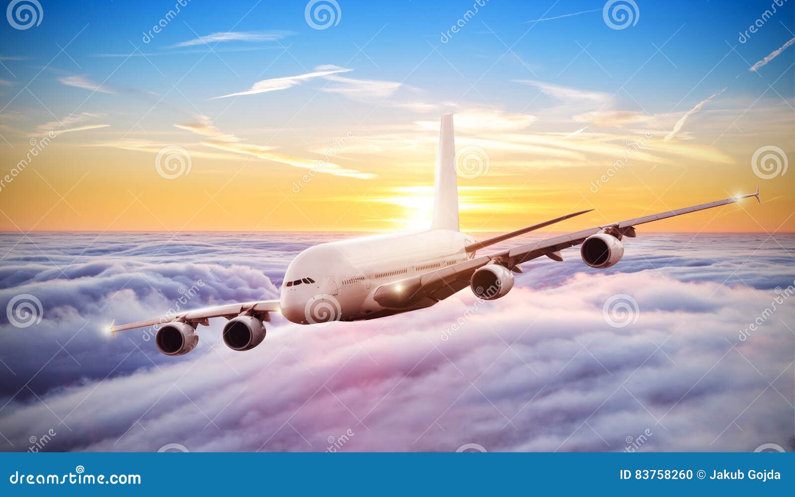 Huge Airplane Flying Above Clouds in Dramatic Sunset Stock Photo ...