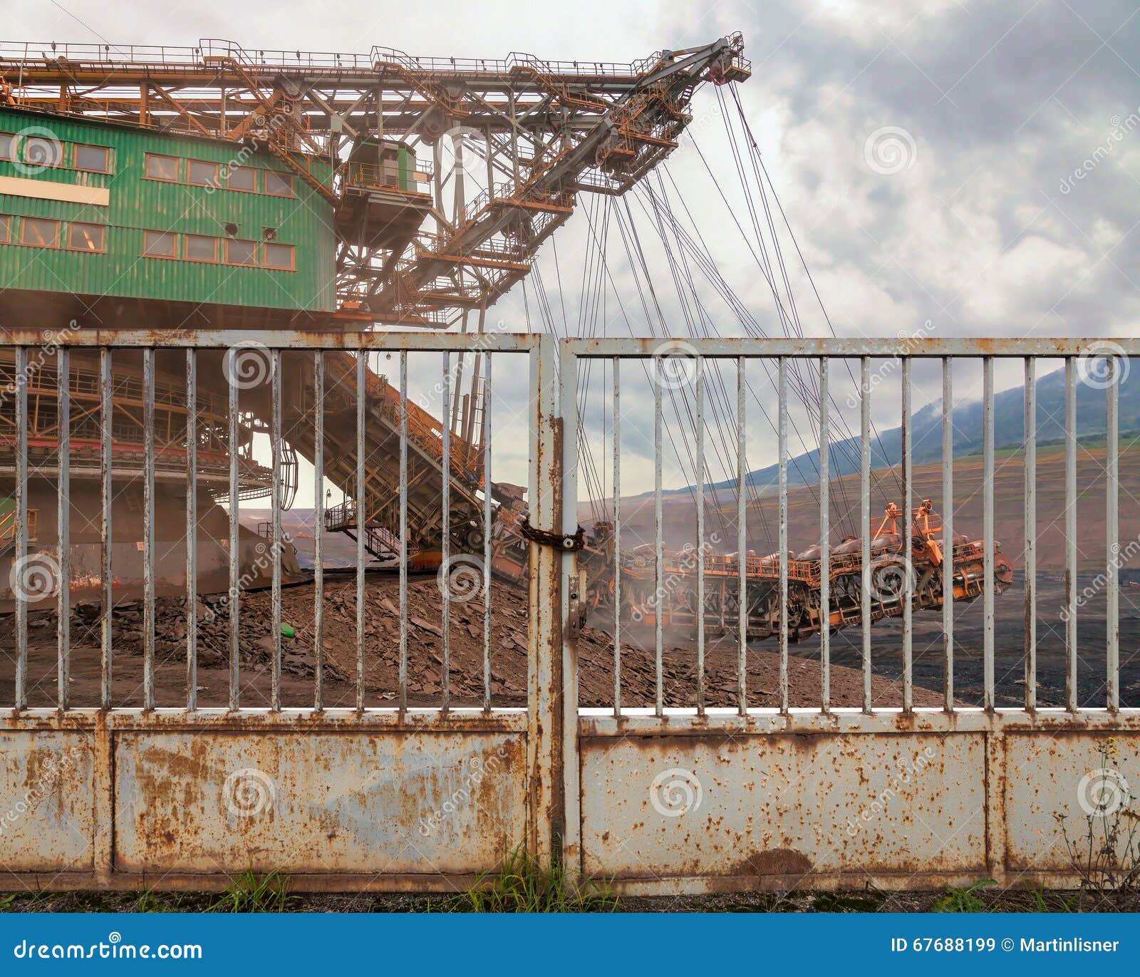 Huge Coal Mining Coal Machine Behind an Iron Gate Stock Image - Image ...