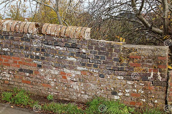 Huge Cracks and Missing Bricks on an Old Brick Wall Stock Photo - Image ...