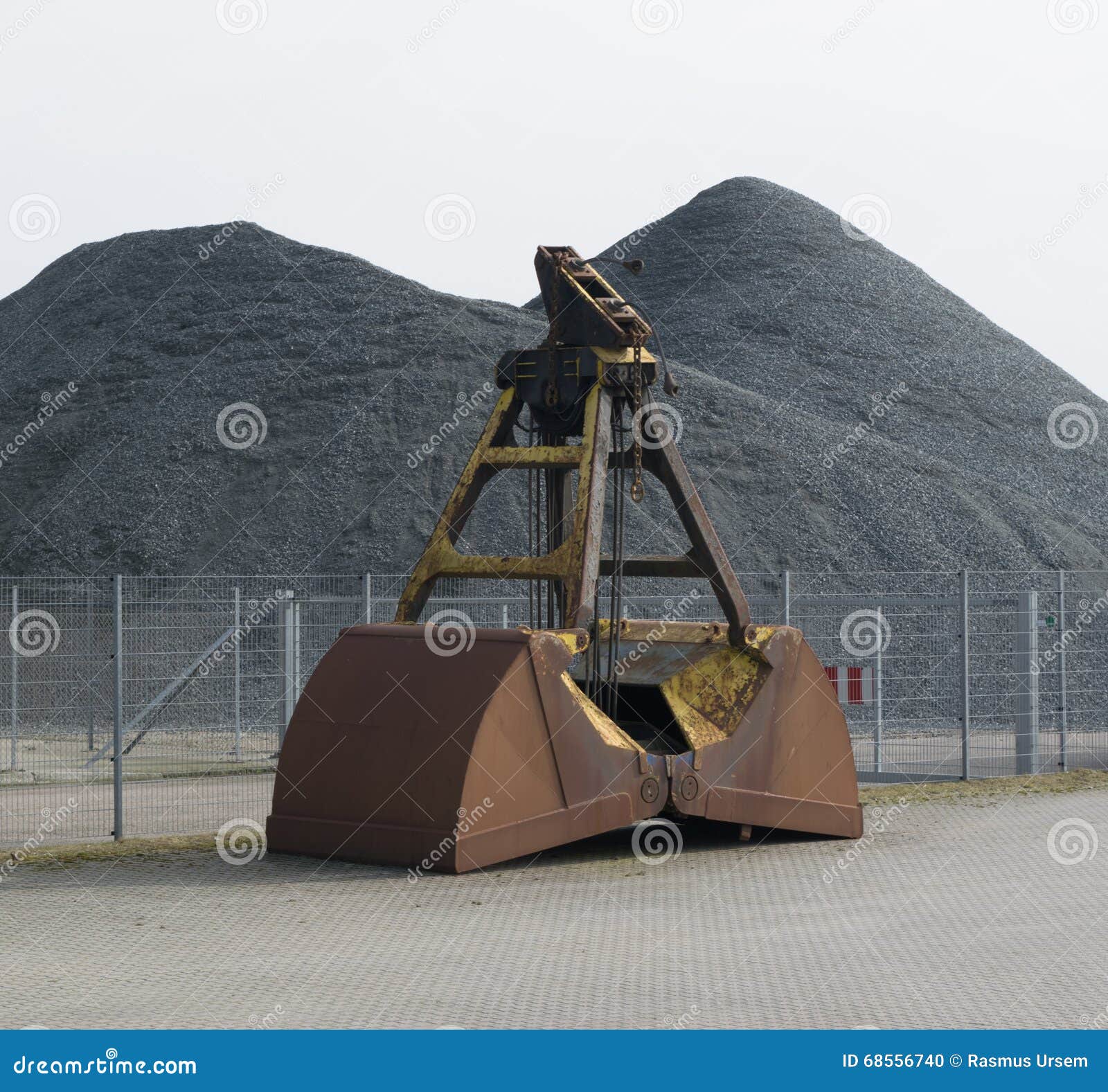 Huge Crane Grab and Two Piles of Stones Stock Photo - Image of ...