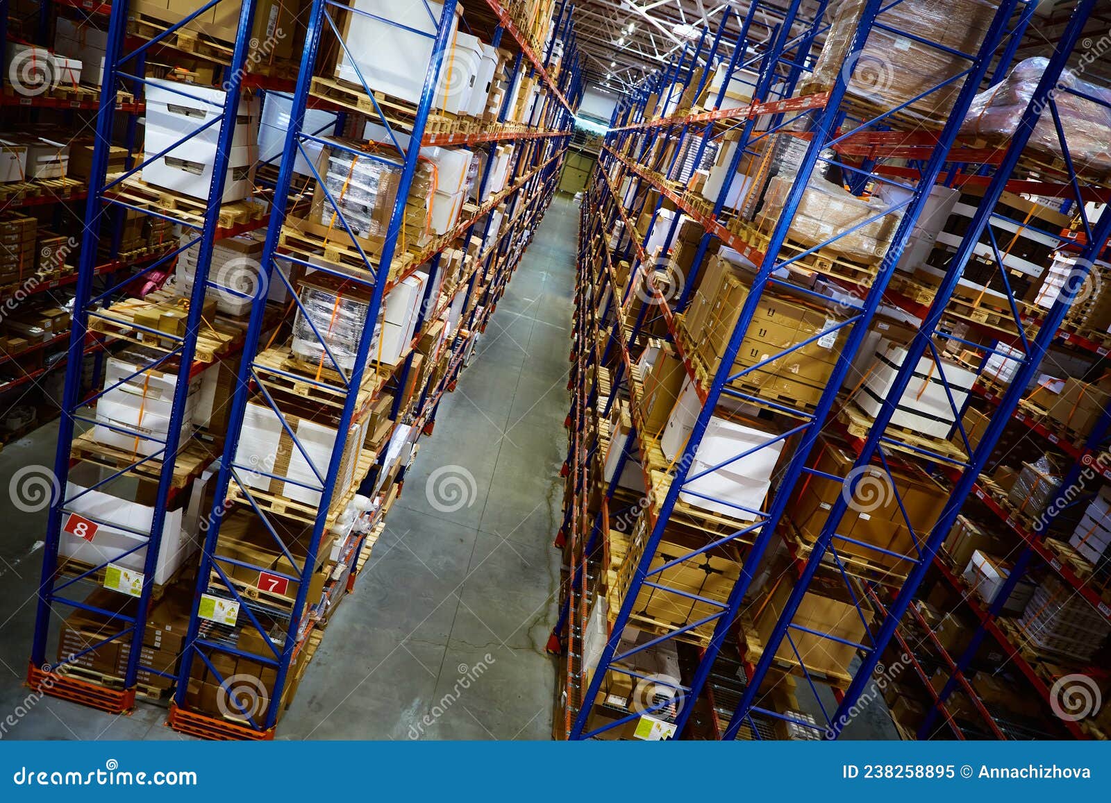 Huge Distribution Warehouse with High Shelves and Loaders. Stock Image ...