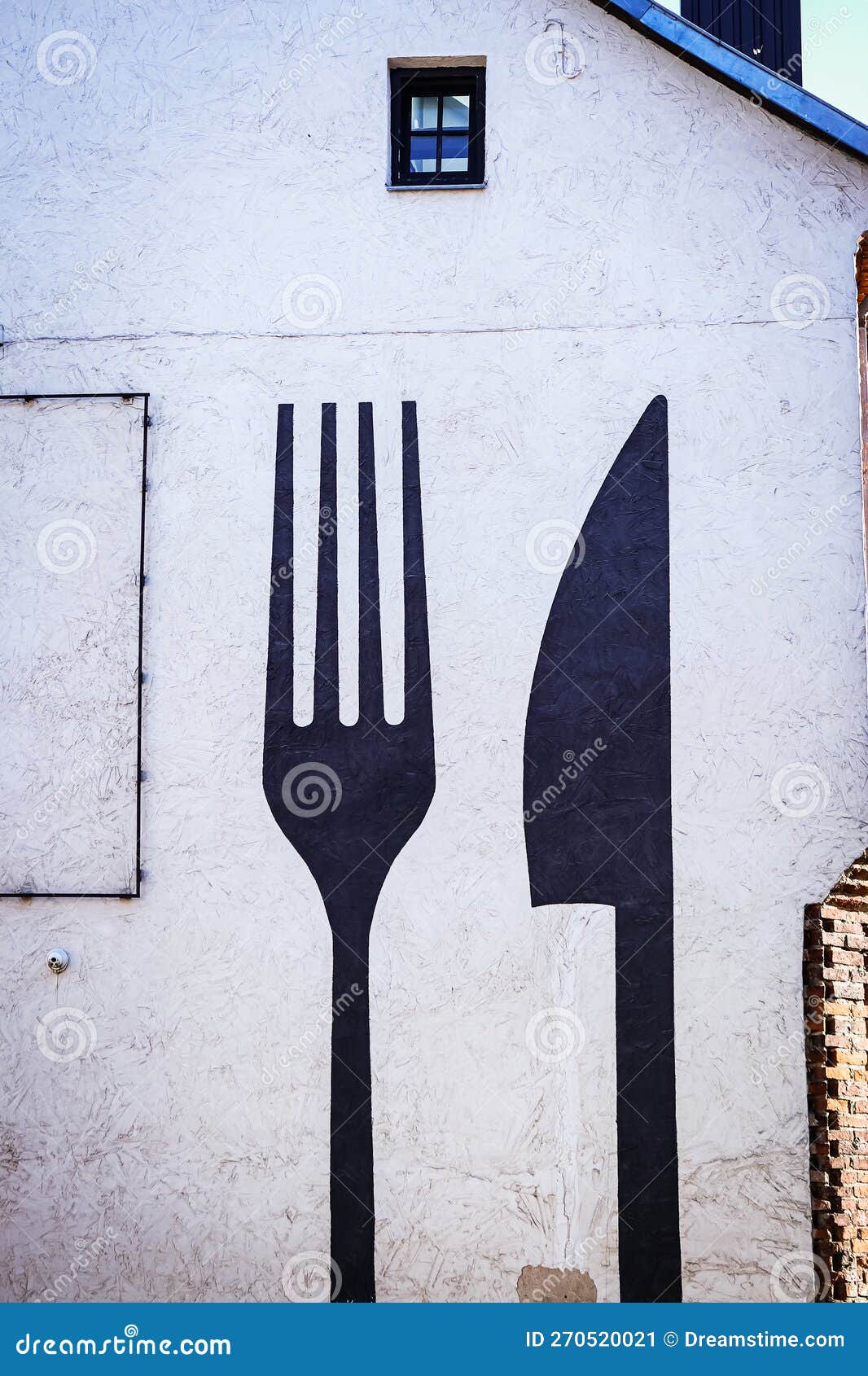 Huge Fork and a Knife Painted in Black on White Building Wall Backside ...